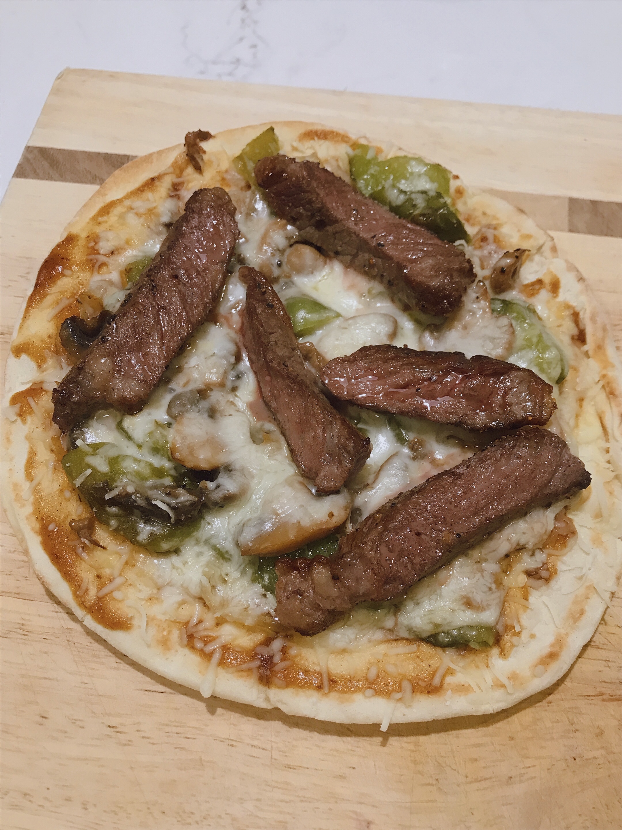 Steak Flatbread with Onions, Peppers, and Mushrooms